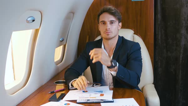 Portrait of young handsome chief banker director businessman flying in ...