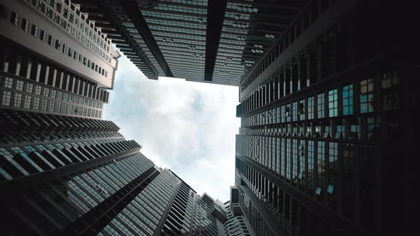 Timelapse of modern architecture building with blue cloudy sky ...