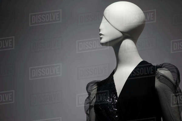 Female mannequin on a gray background. - Stock Photo - Dissolve