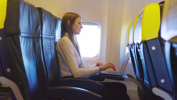 Tired business lady taking nap after work on wireless laptop while ...