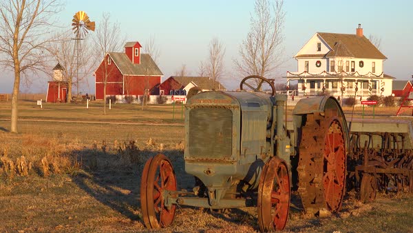 Establishing shot of a classic beautiful small town farmhouse farm ...