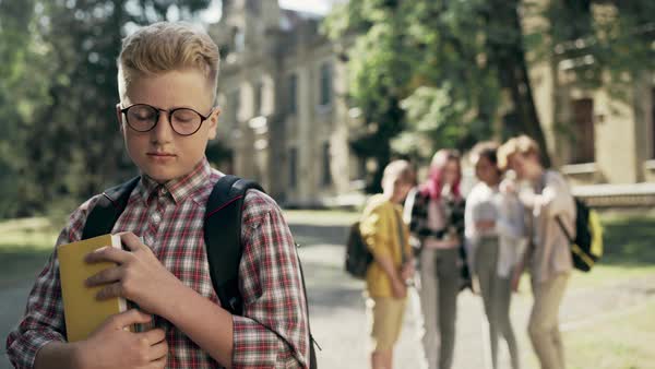 School children laughing at overweight classmate, bullying problem ...