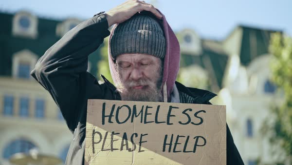 Lonely elderly man holding homeless please help sign, social ...