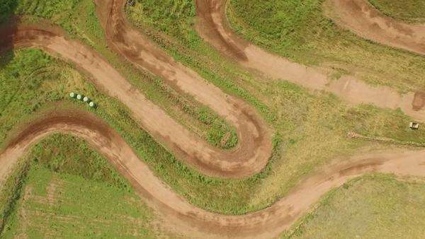 Tracking birds eye view drone shot of quad bikes / off road vehicle on ...