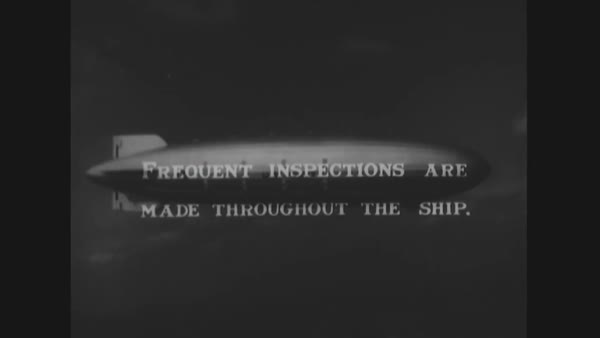 1932 - A sailor moves along the catwalk inside the USS Akron ...