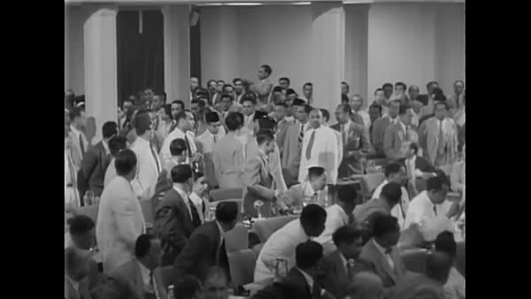 1955 - Delegates from different countries talk amiably to each other at ...