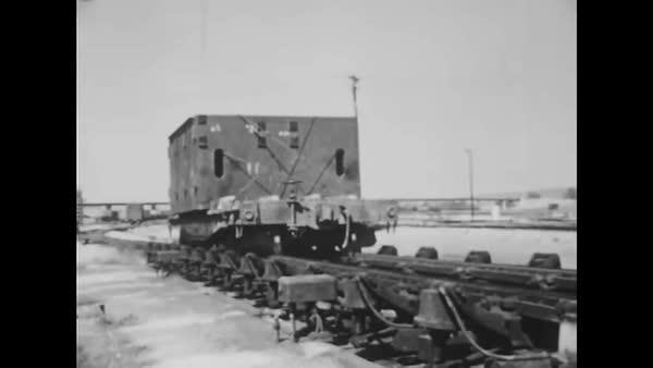 Train cars are connected and a train car carrying fruit is filled with ...