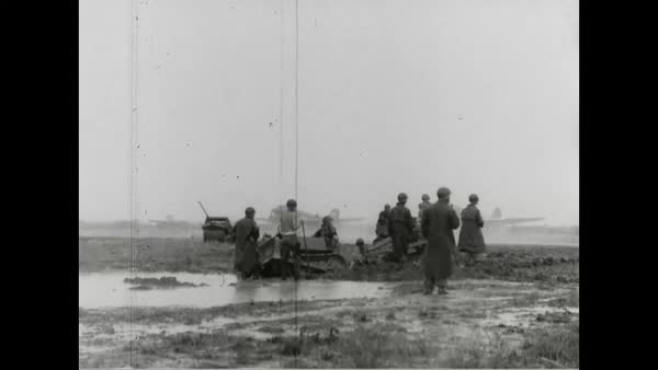 1944 - US Army Air Force planes are seen in a muddy airfield in ...