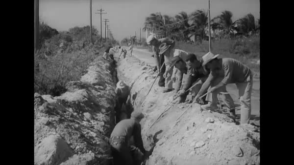 1935 - Men of the Public Works Administration lay pipe in Key West ...