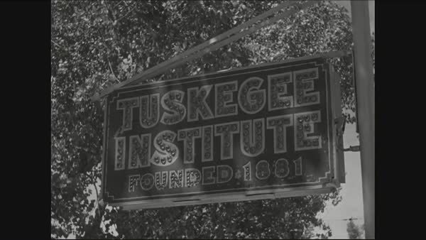 1940s - The entry sign for Tuskegee Institute is shown; soldiers march ...