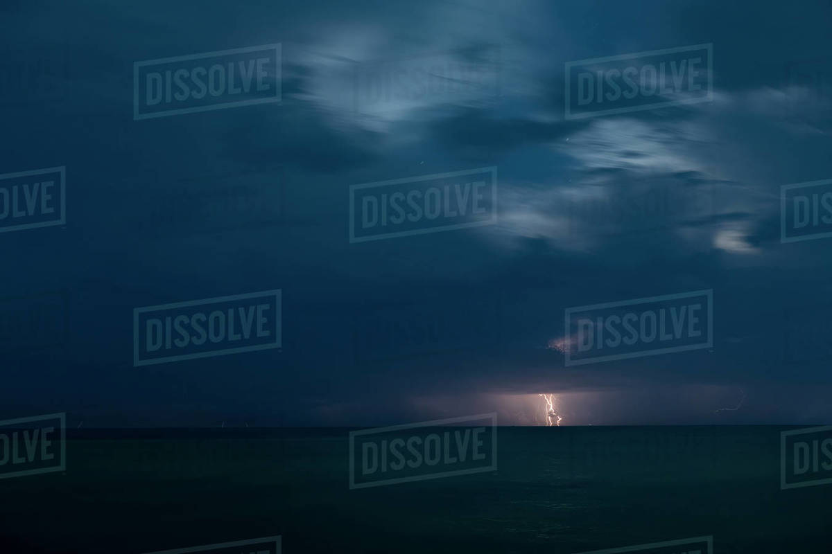 Lightning over water. Electric discharge. Nature background for design ...