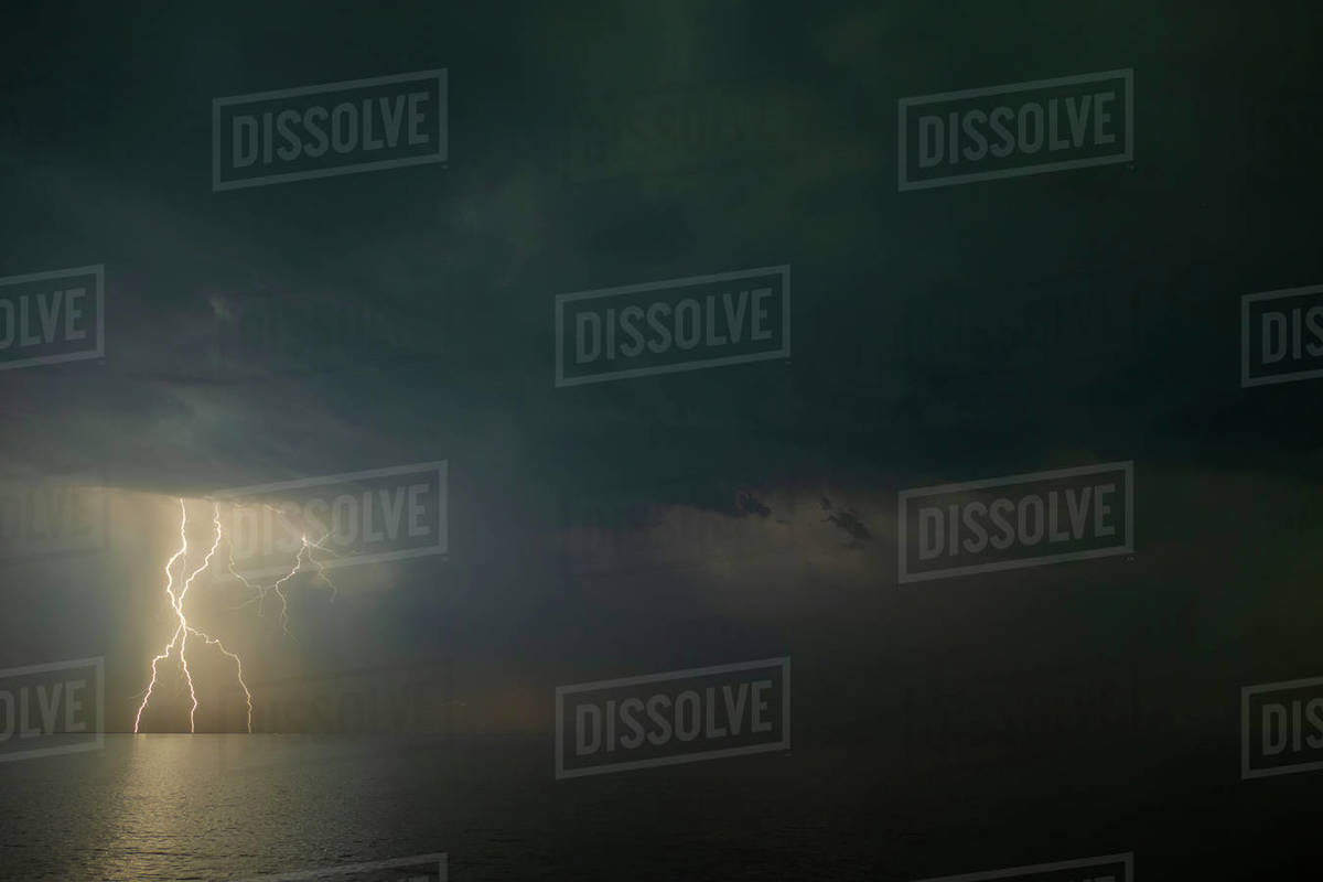 Lightning over water. Electric discharge. Nature background for design ...