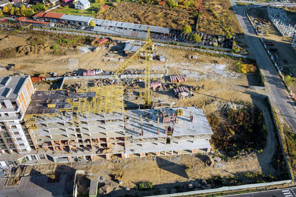 Construction of residential high rise building with a tower crane in ...