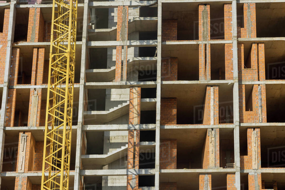 Construction of a multi storey apartment building are work along the ...