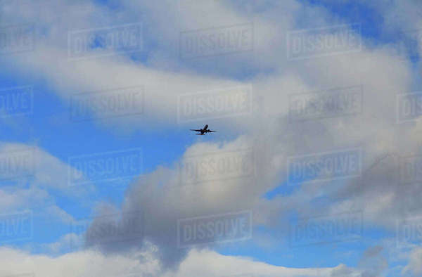 airplane flying through dark stormy clouds aircraft flying through ...