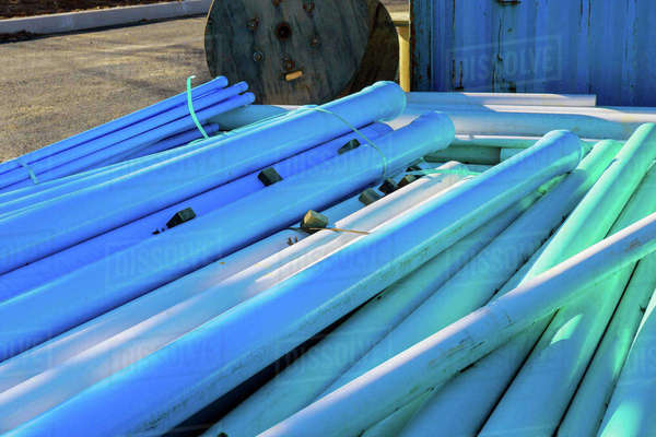 Pallets of blue sewer PVC pipes at construction for drainage system ...