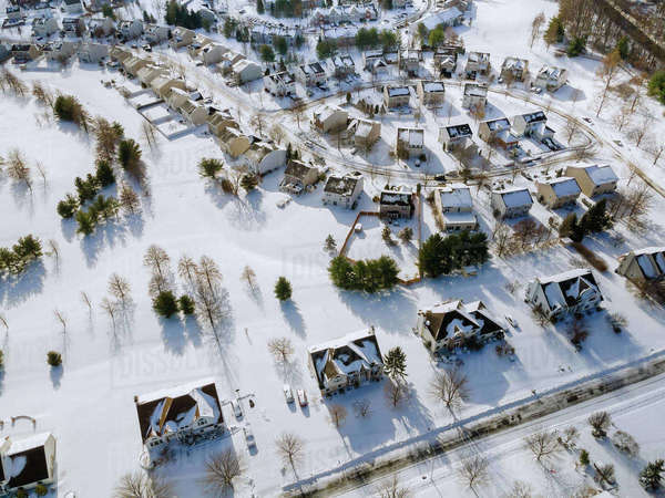 Aerial panorama view of snowed in traditional housing suburbs in snow ...
