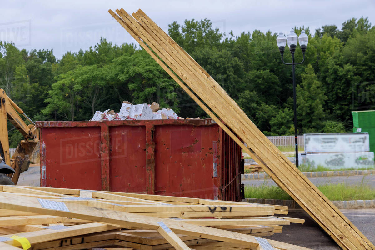 Construction trash garbage dumpsters on metal container house ...