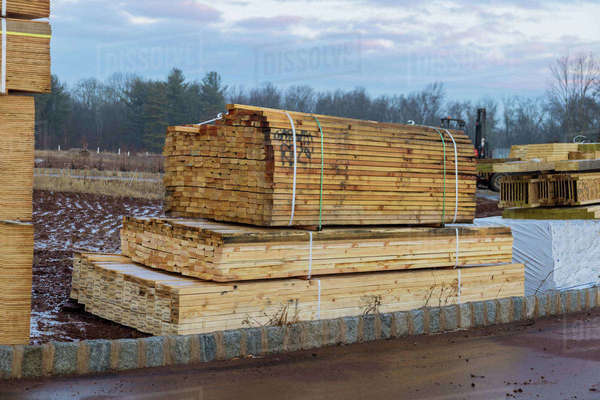 Wood stacked on house building materials from at a construction site ...