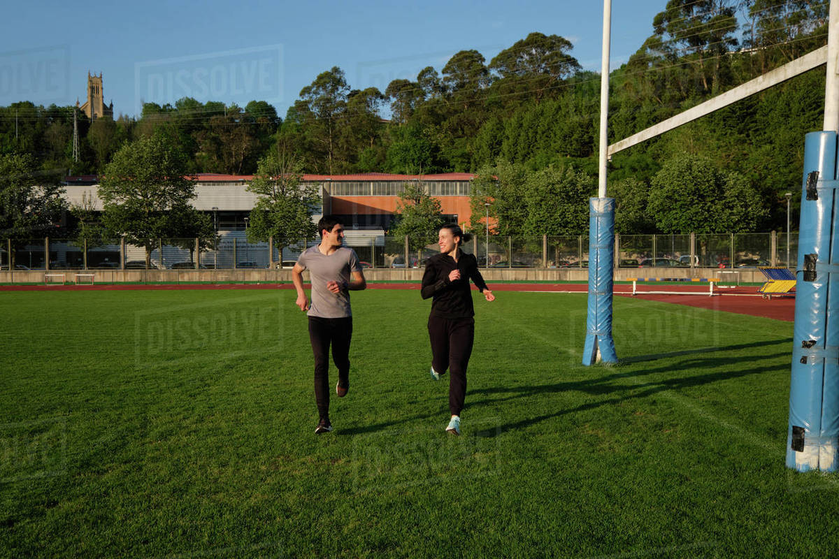 two young adult athletes competing against each other to win a friendly ...