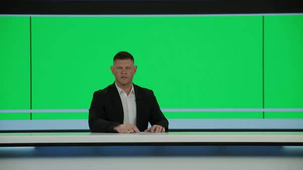 GREEN SCREEN CHROMA KEY Caucasian male anchorman reporting on a story ...
