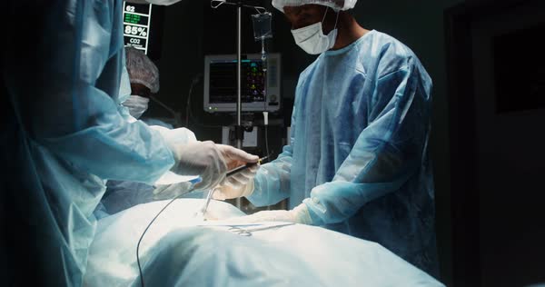 Surgical operation in a modern, well-equipped operating room. Dynamic ...