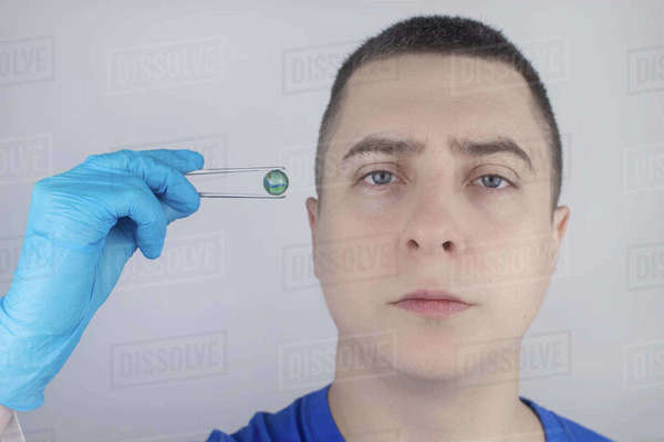 Conceptual shot of an eye crystalline lens replacement. Ophthalmic ...