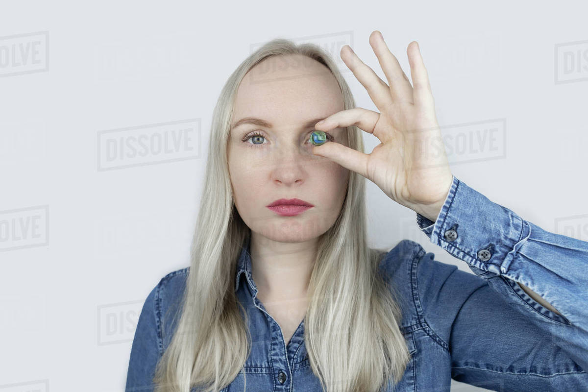 Conceptual shot of an eye crystalline lens replacement. Ophthalmic ...