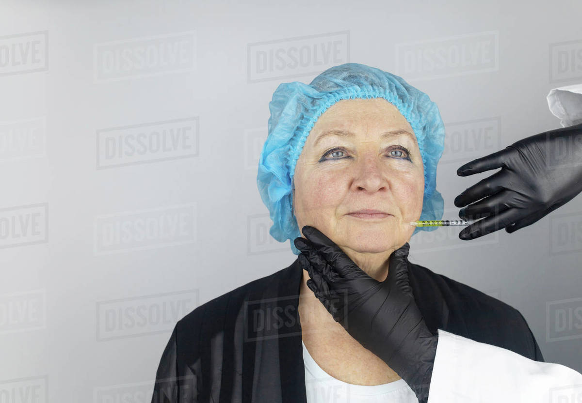 Botulinum toxin injection. Senior woman at the appointment with a ...