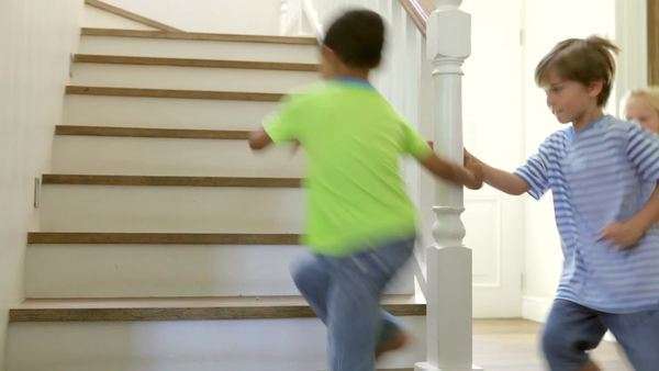 Group of children at home running up and down stairs. - HD Royalty-free ...