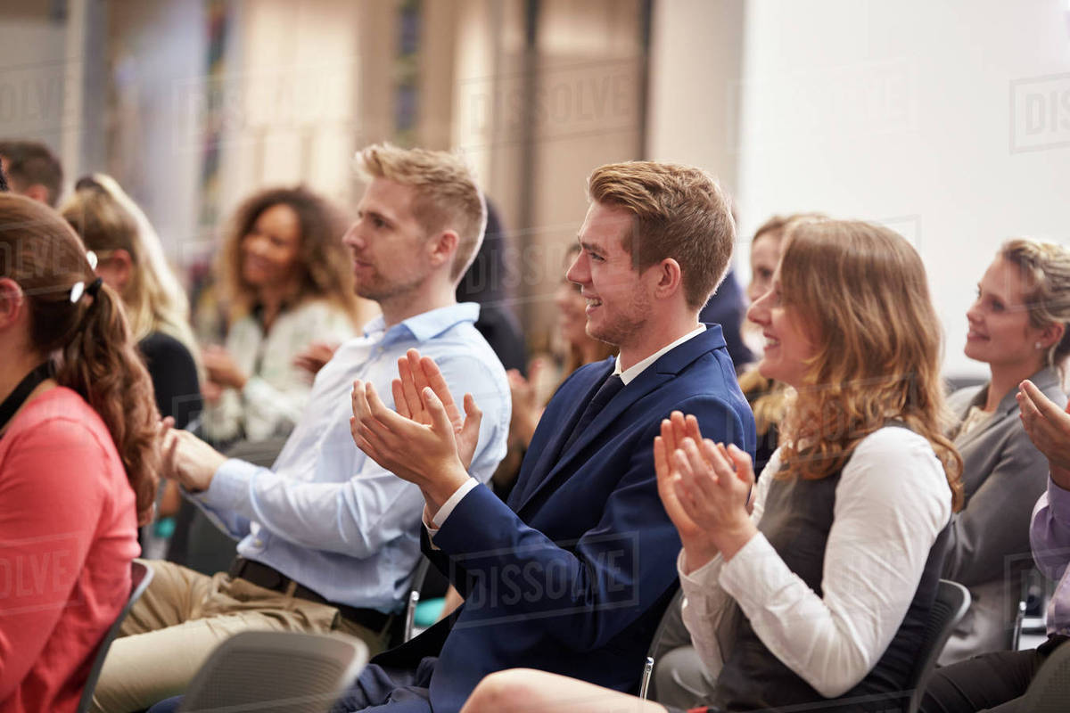 Audience applauding speaker after conference presentation - Royalty ...