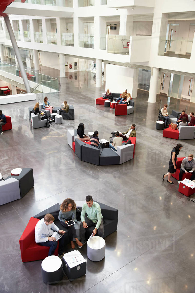 Students sitting in university atrium, vertical - Royalty-free Stock ...