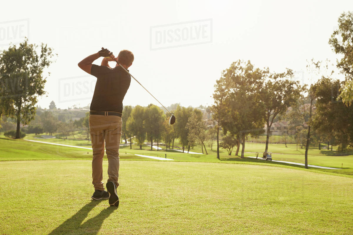 Male Golfer Lining Up Tee Shot On Golf Course - Royalty-free Stock ...