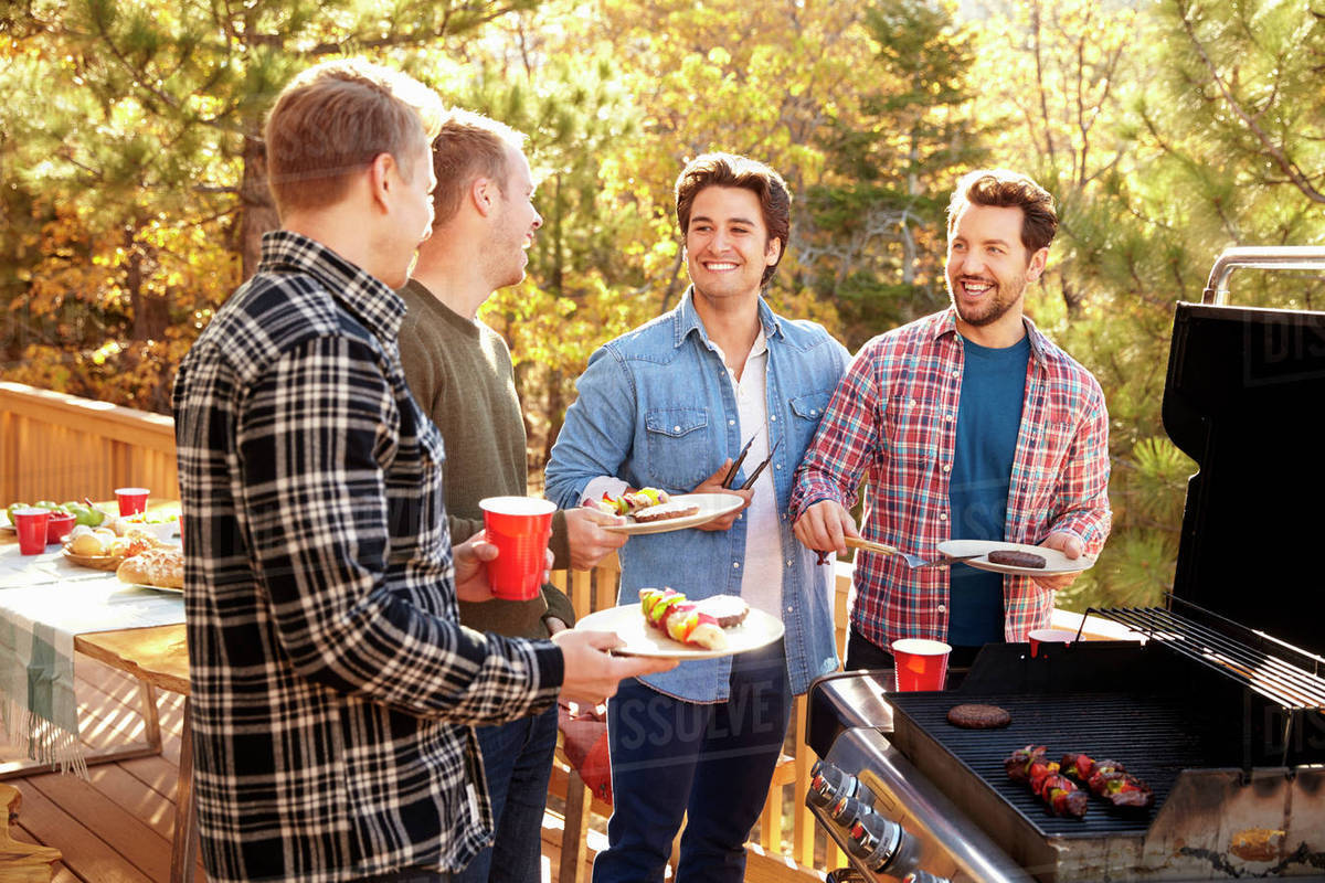 Group Of Gay Male Friends Enjoying Barbeque Together - Royalty-free ...