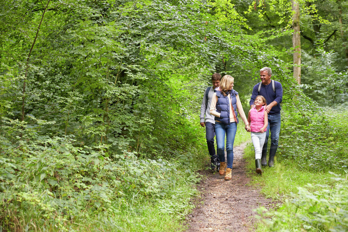 Family On Walk Through Beautiful Countryside - Royalty-free Stock Photo ...
