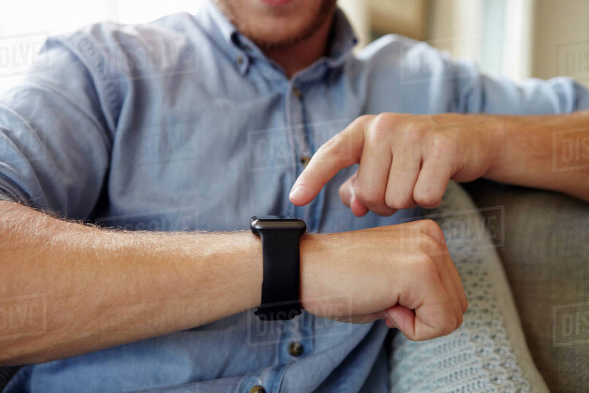 Close Up Of Man Wearing Smart Watch - Stock Photo - Dissolve
