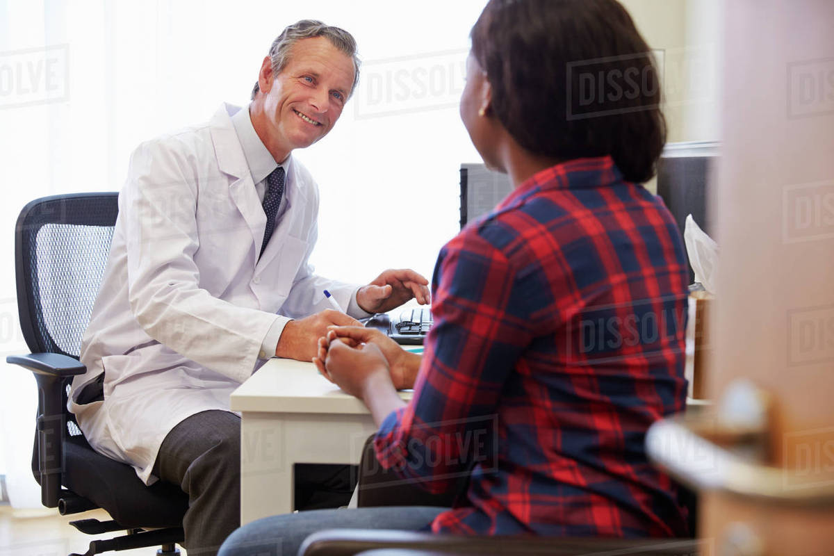 Female patient having consultation with doctor in office - Royalty-free ...