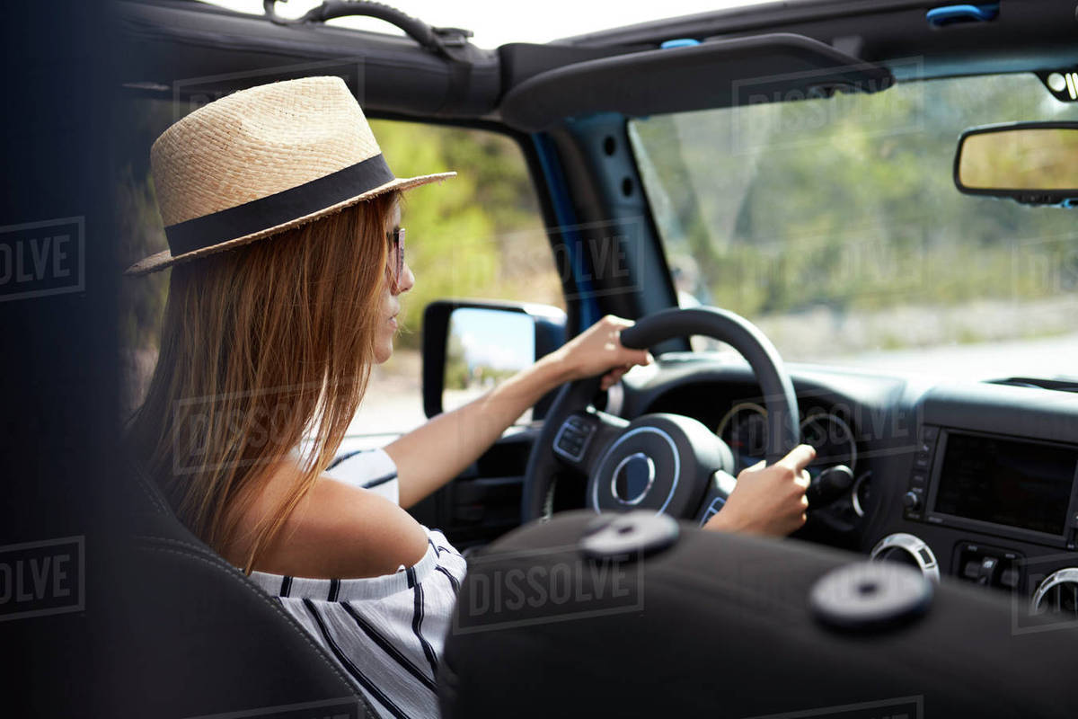 Young Woman Driving Open Top Car On Country Road - Royalty-free Stock ...