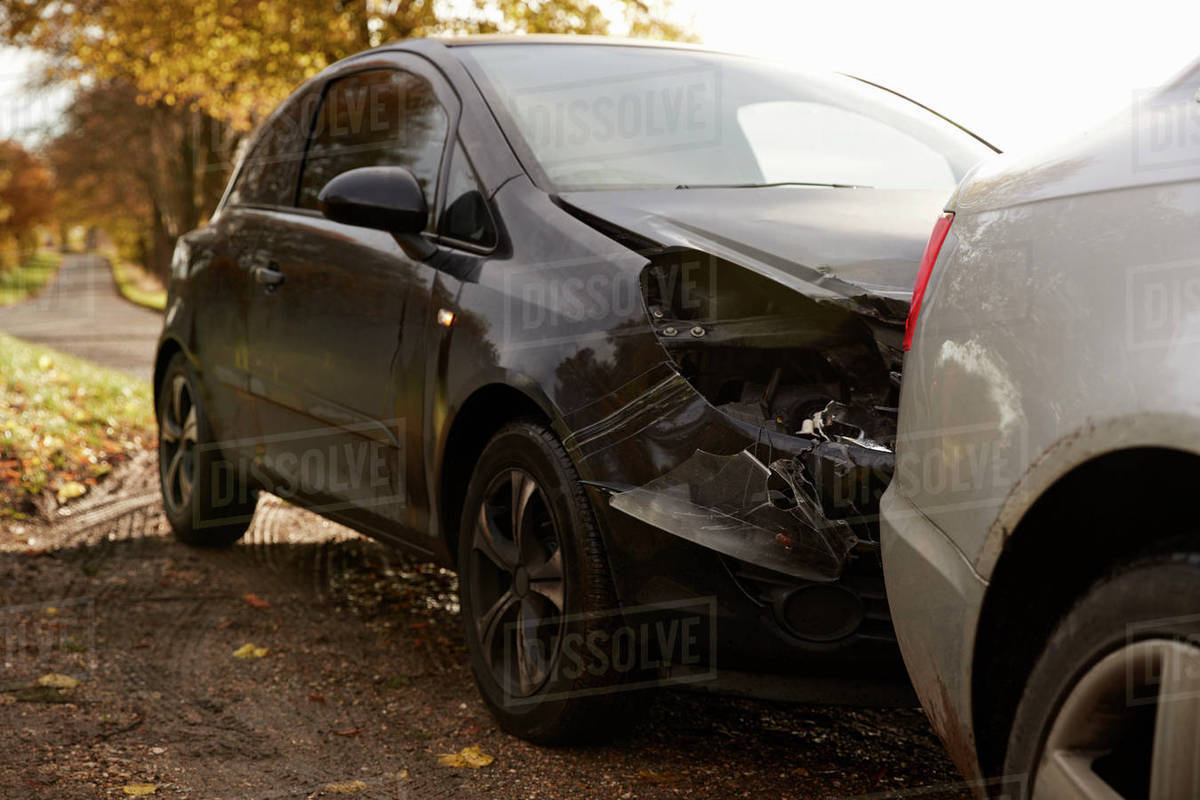 Close up of damaged car after road accident - Stock Photo - Dissolve