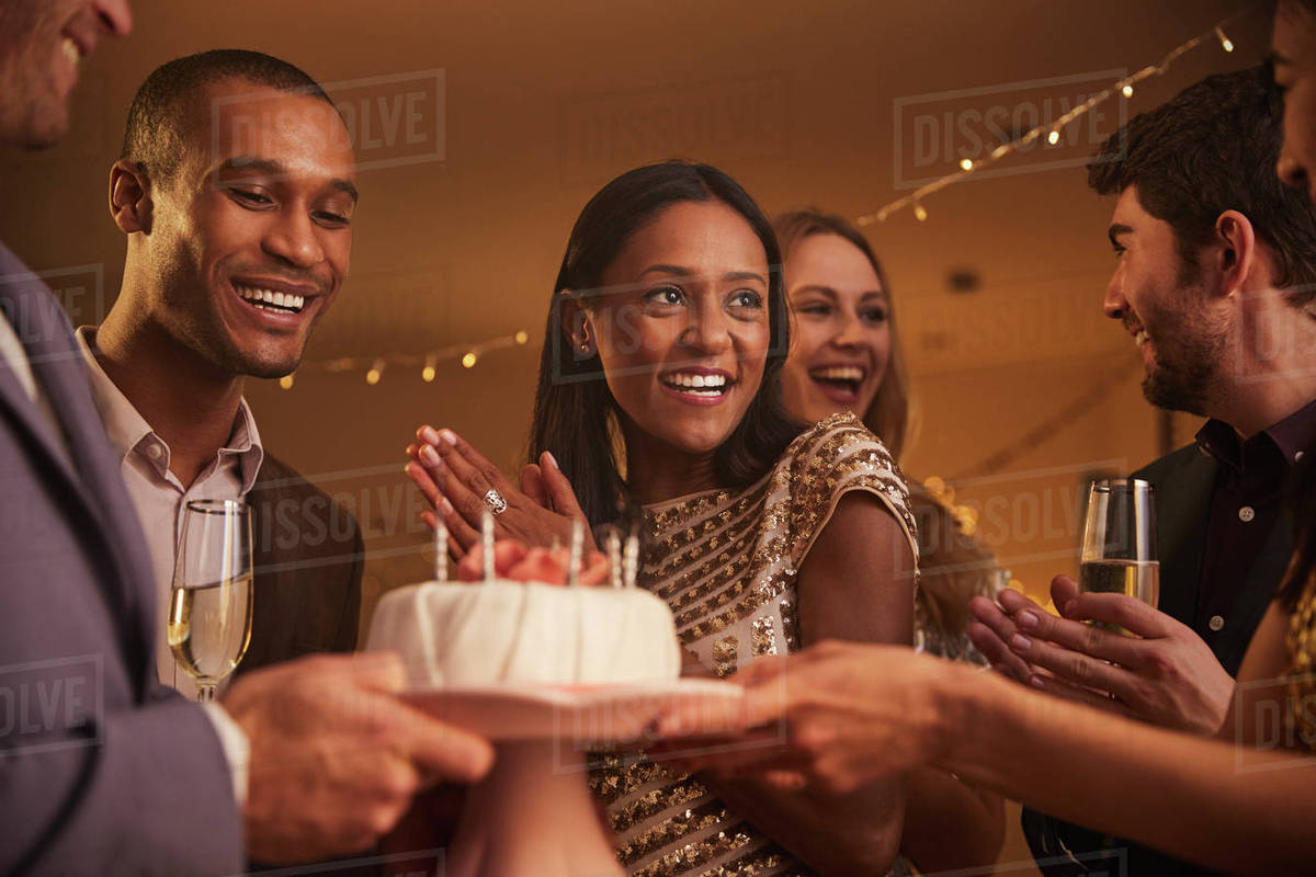 Group of friends celebrating birthday with party at home - Royalty-free ...