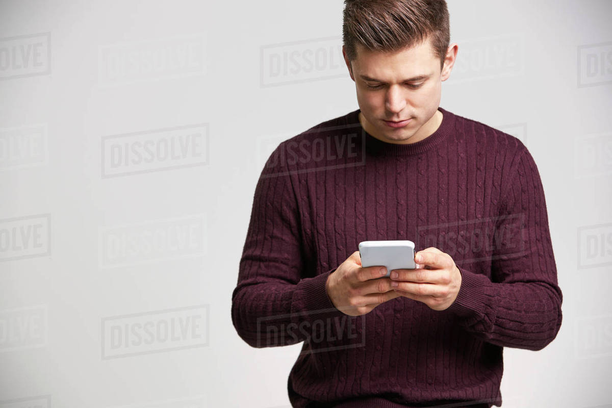 Portrait of a young white man using a smartphone - Royalty-free Stock ...