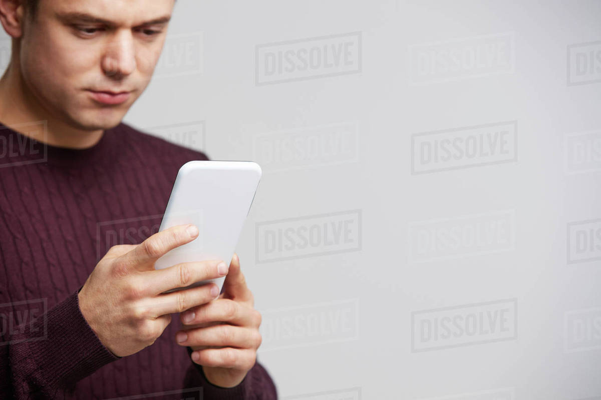 Cropped portrait of a young white man using a smartphone - Stock Photo ...