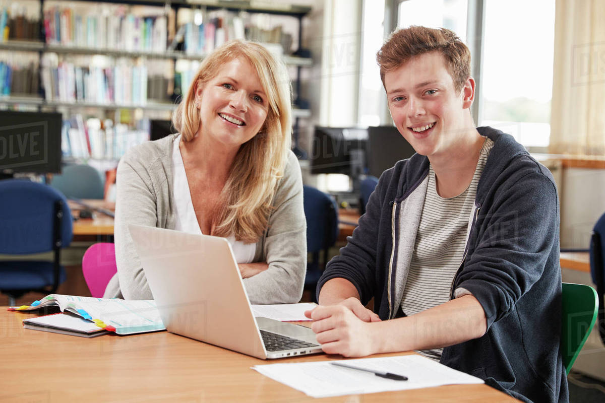 College Student Has Individual Tuition From Teacher In Library ...