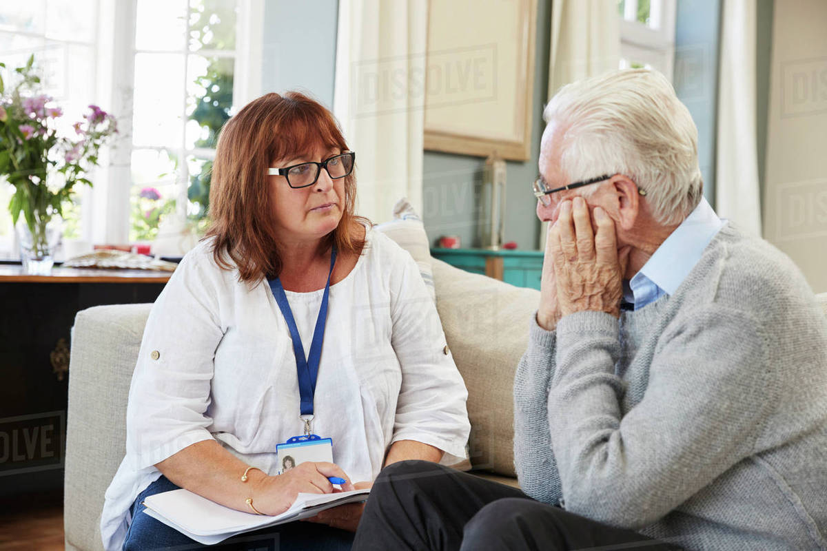 Female Support Worker Visits Senior Couple At Home - Royalty-free Stock ...