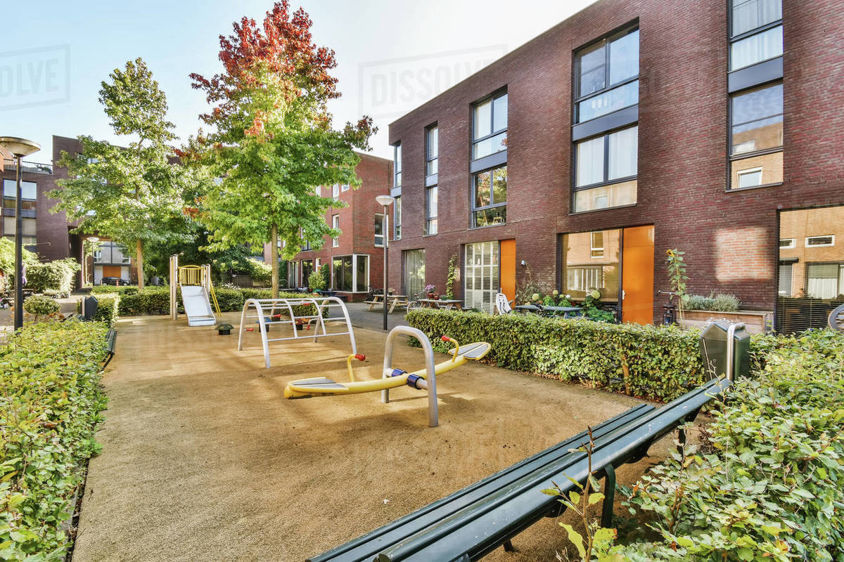 The courtyard of a residential complex with a playground - Royalty-free ...