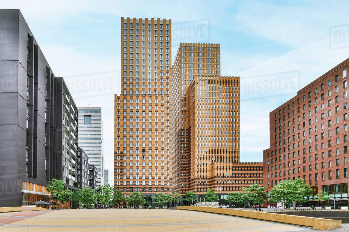 Tall brick and glass high-rise buildings design - Stock Photo - Dissolve