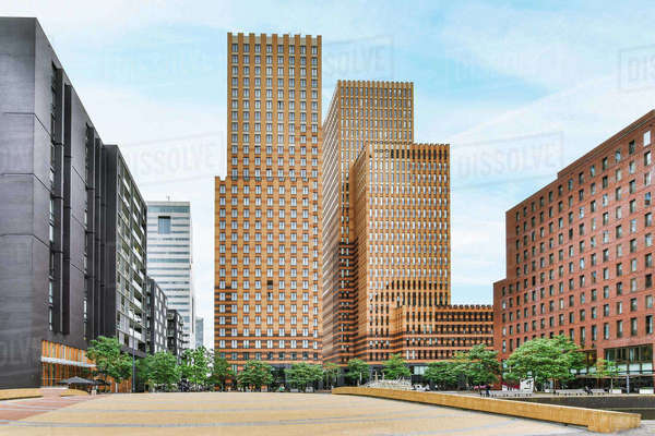 Tall brick and glass high-rise buildings design - Stock Photo - Dissolve