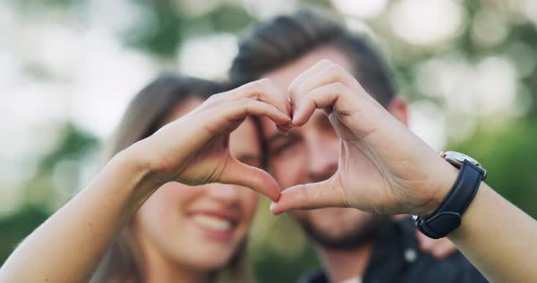 Park, love and couple hands in heart for bonding, romance and emoji ...