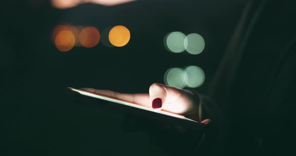 Woman, hands and phone typing at night for communication, social media ...