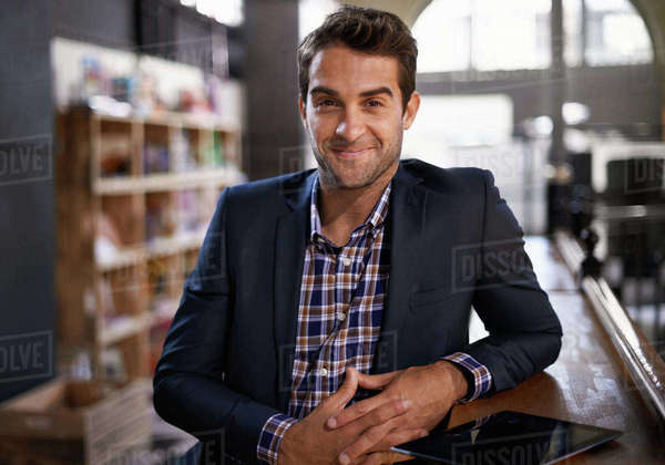 Professional man at pub, happy in portrait and relax on a break and ...